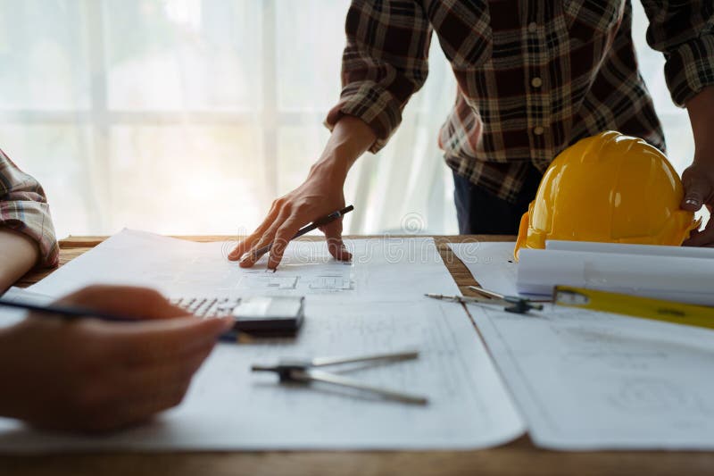 Multi Ethnic Engineer Brainstorming and Measuring for Cost Estimating ...