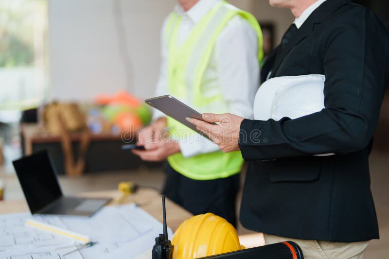 Multi Ethnic Engineer Brainstorming and Measuring for Cost Estimating ...