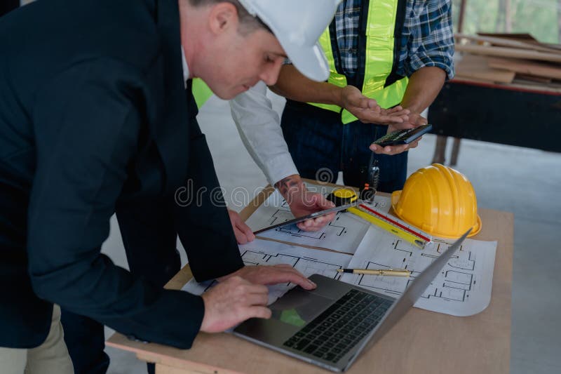 Multi Ethnic Engineer Brainstorming and Measuring for Cost Estimating ...