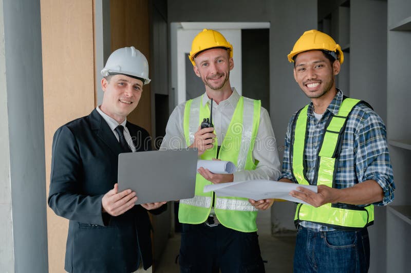 Multi Ethnic Engineer Brainstorming and Measuring for Cost Estimating ...