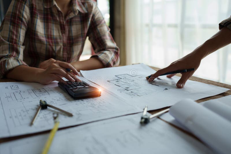 Multi Ethnic Engineer Brainstorming and Measuring for Cost Estimating ...