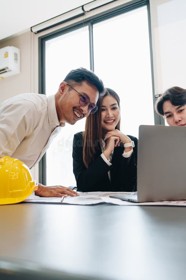 Multi Ethnic Engineer Brainstorming and Measuring for Cost Estimating ...