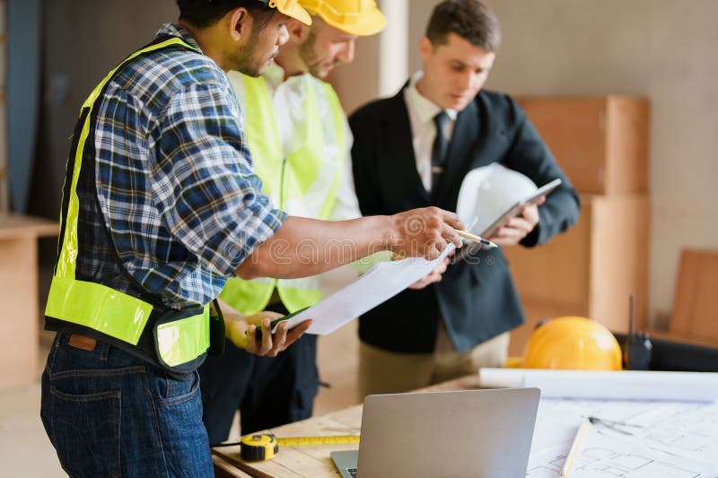 Multi Ethnic Engineer Brainstorming and Measuring for Cost Estimating ...