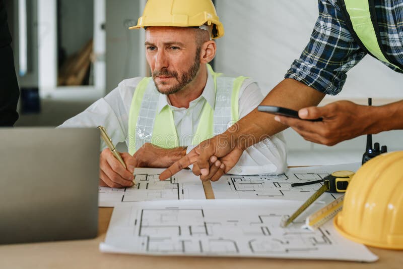 Multi Ethnic Engineer Brainstorming and Measuring for Cost Estimating ...