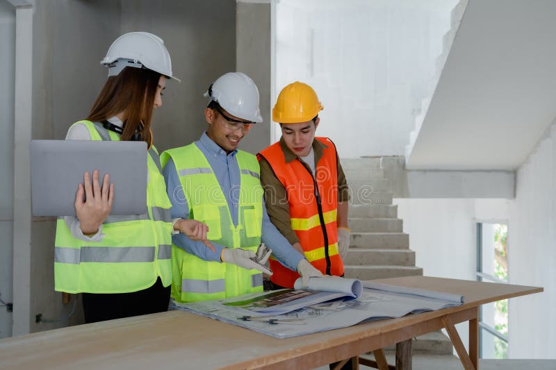 Multi Ethnic Engineer Brainstorming and Measuring for Cost Estimating ...