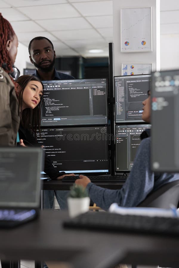 Multi Ethnic Engineers Analyzing Server Code and Database Stock Photo ...
