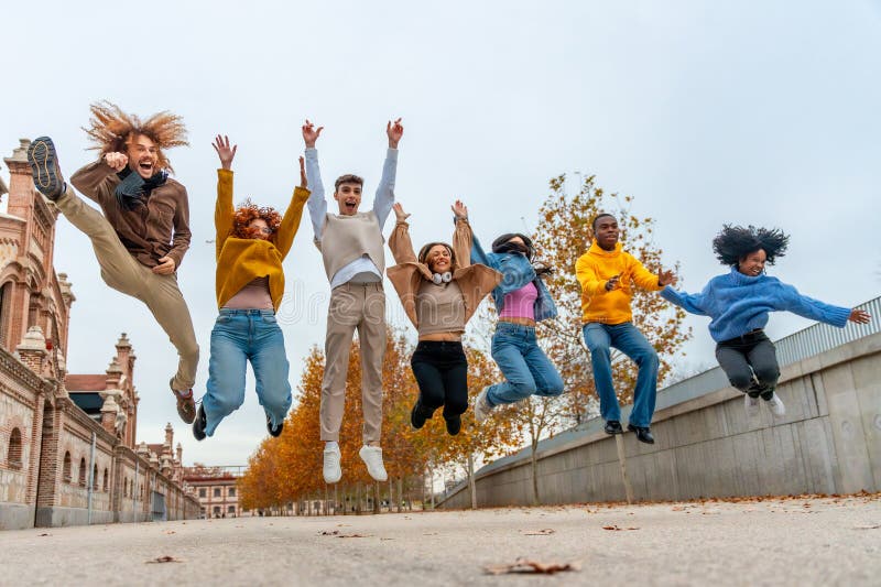 Multi-ethnic Friends Jumping in an Urban Park Stock Photo - Image of ...