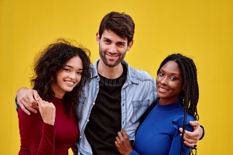 Multi-ethnic Friends Looking at Camera and Smiling while Posing ...