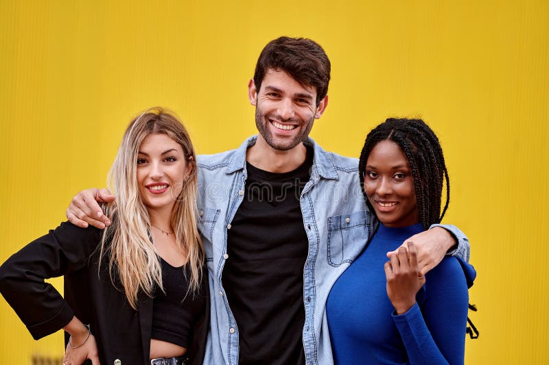 Multi-ethnic Friends Looking at Camera and Smiling while Posing ...