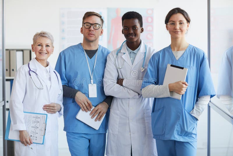 Multi-Ethnic Group of Doctors Posing in Clinic Stock Image - Image of ...