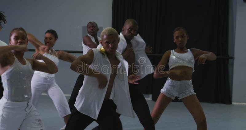 Multi-ethnic Group of Fit Male and Female Modern Dancers Practicing ...