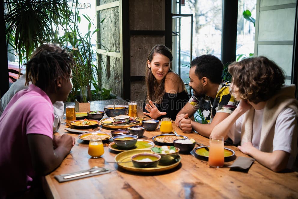 Multi-ethnic Group of Friends Having a Good Time in a Cafe Stock Image ...