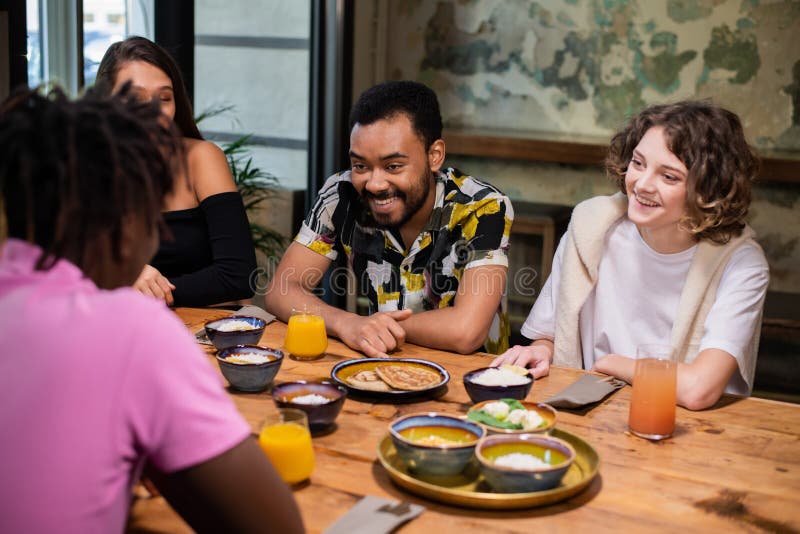 Multi-ethnic Group of Friends Having a Good Time in a Cafe Stock Photo ...