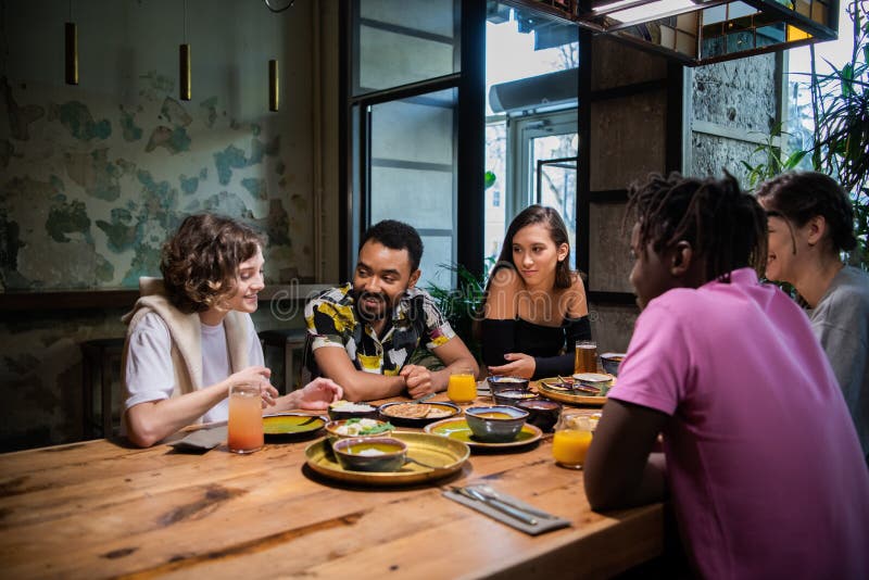 Multi-ethnic Group of Friends Spending Time in a Cafe Stock Image ...