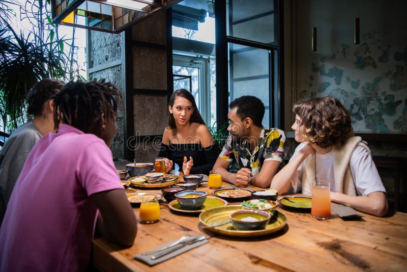 Multi-ethnic Group of Friends Spending Time in a Cafe Stock Image ...