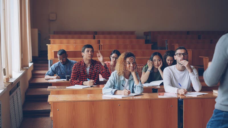 Multi-ethnic Group of Students is Answering Teacher S Questions, Smart ... Multi-ethnic Group of Students is Answering Teacher S Questions, Smart ...