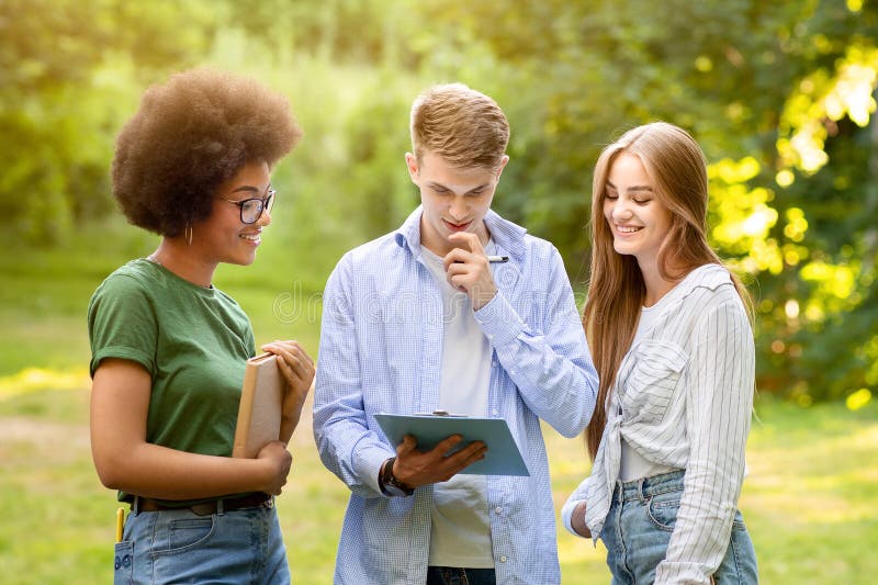 Multi-ethnic Group of Students Spending Time Together Outdoors at ...