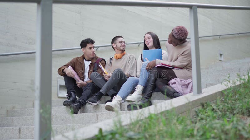 Multi-ethnic Group of Students, Take a Break Sitting on the Stairs of ...