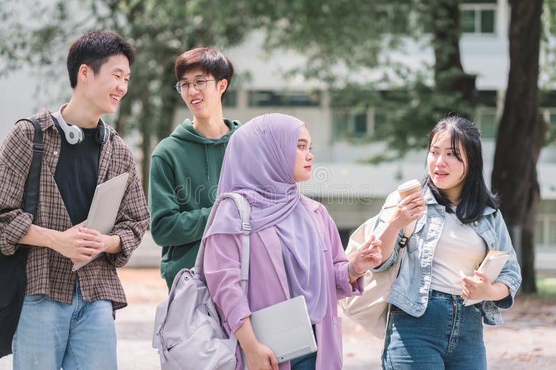 Multi Ethnic Group of University Students Walks and Talks Together ...
