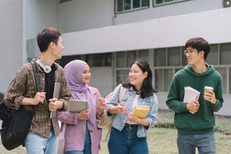 A Group of Diverse, Multiracial Young People are Shown Happily Stacking ...