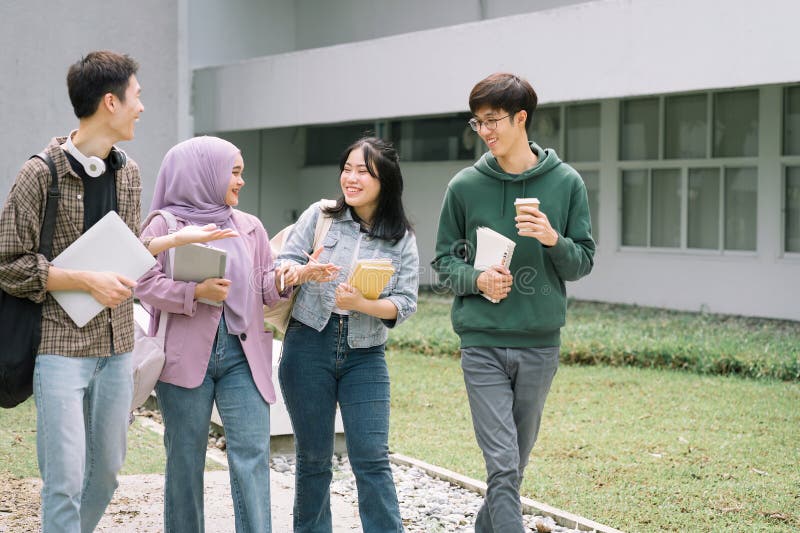 Multi Ethnic Group of University Students Walks and Talks Together ...