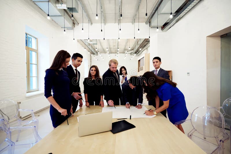 Multi Ethnic Group of Young Designers and Architects Working Together ...