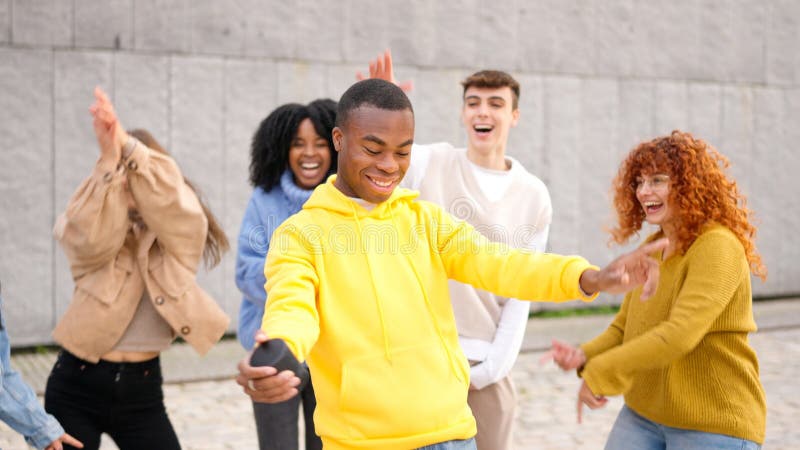 Multi-ethnic Happy Friends Dancing Excited in the City Stock Image ...