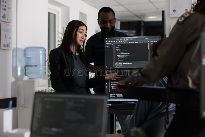 Multi Ethnic Programmers Checking Source Code And Database Stock Image Image Of Network