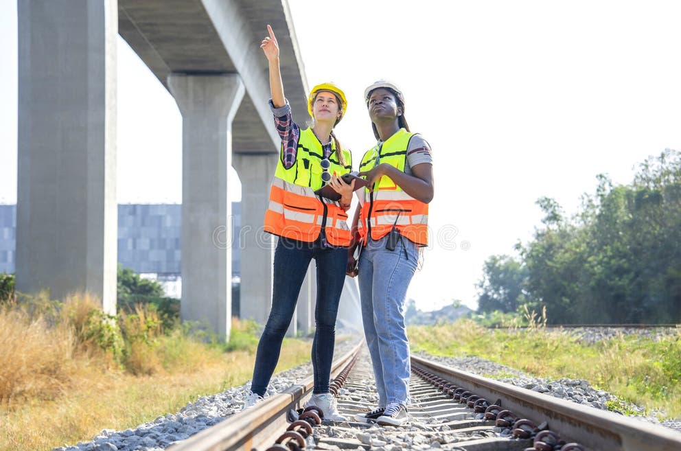 Multi Ethnic Railway Construction Workers Working Outdoors,standing at ...