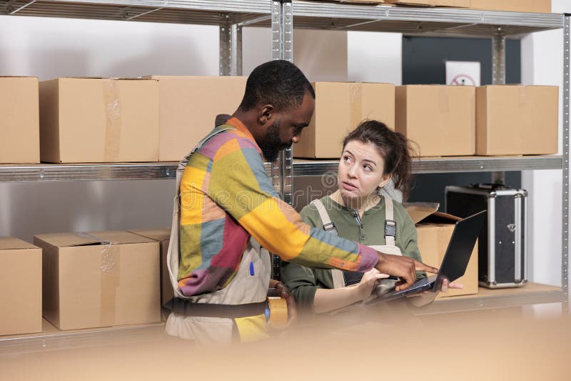 Multi Ethnic Stockroom Supervisor Packing Parcels Stock Photo - Image ...