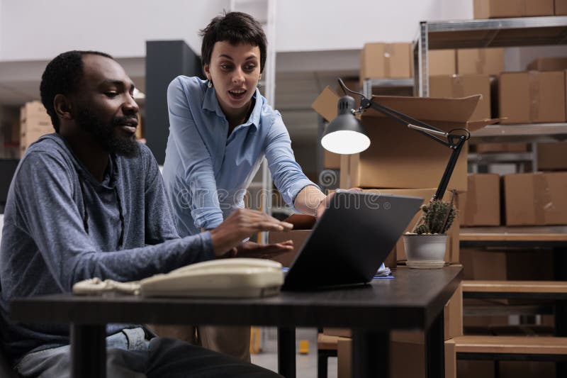 Multi Ethnic Storehouse Employees Looking at Cargo Stock Analyzing ...