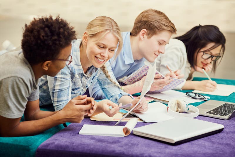 Multi-ethnic Students Preparing for Difficult Test Together Stock Image ...