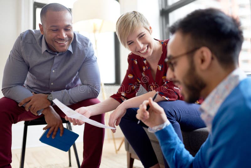 Multi-ethnic Team of Creative Millenials Collaborating on a Brainstorm ...
