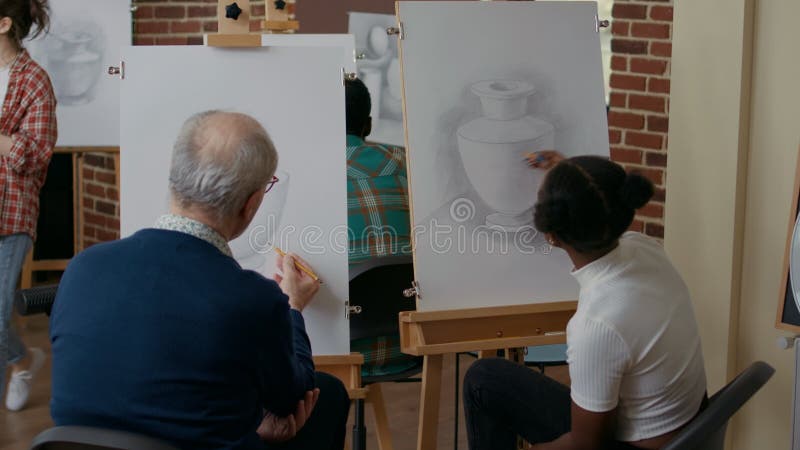 Multi Ethnic Team of People Learning Drawing Technique Together Stock ...