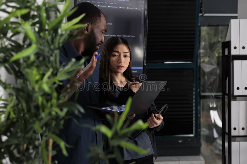 Multi Ethnic Team of System Developers Analyzing Html Code Stock Photo ...