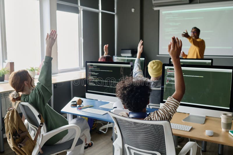 Multi-ethnic Teenagers Answering during it Class Stock Photo - Image of ...