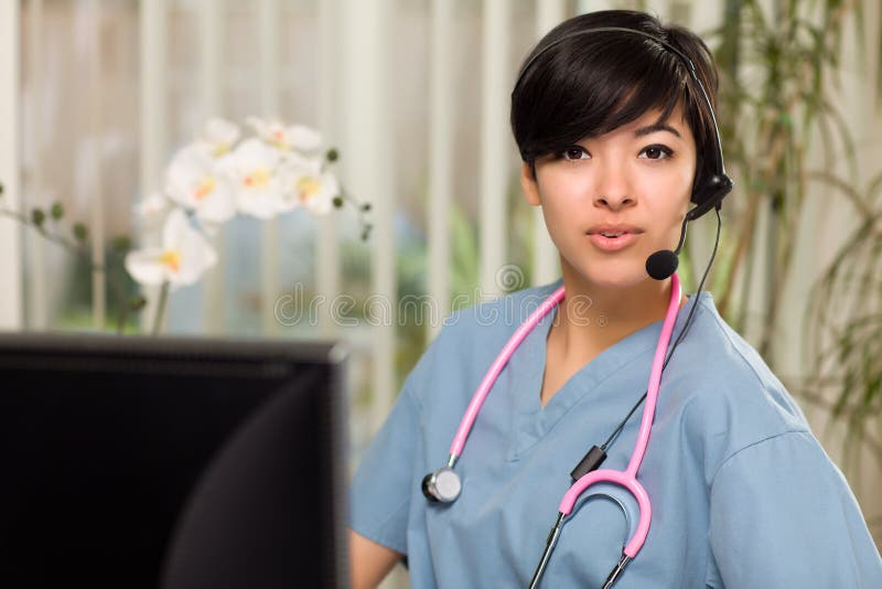 Multi-ethnic Woman Wearing Headset And Stethoscope Picture. Image: 18587014