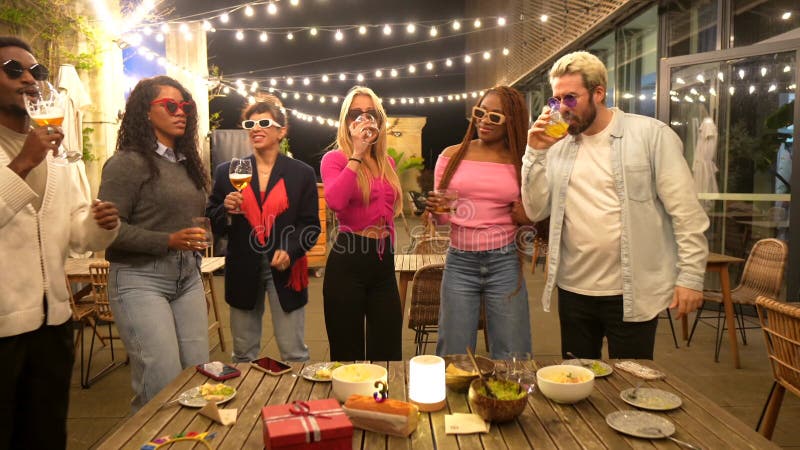 Multi-ethnic People Drinking Standing at Bar Terrace at Night Stock ...