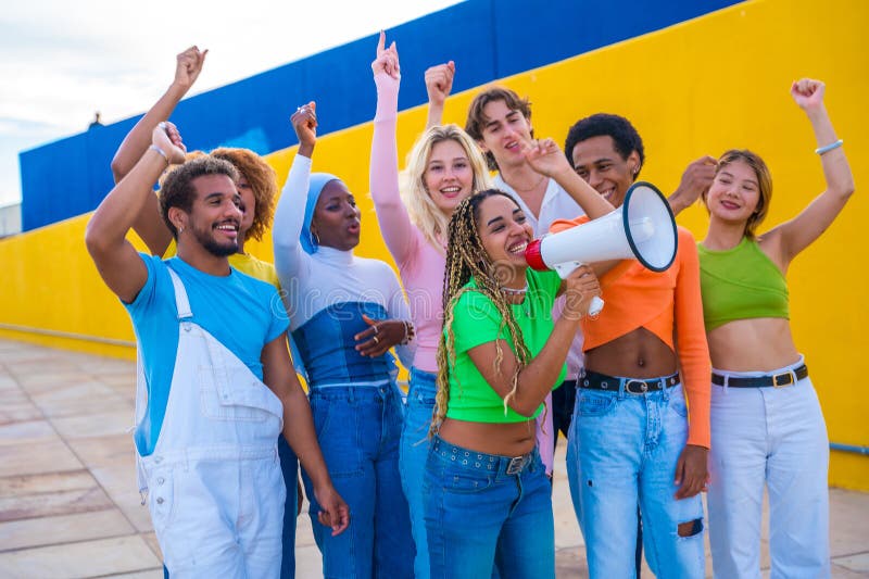 Multi-ethnic Young People Yelling Using a Loudspeaker Stock Image ...