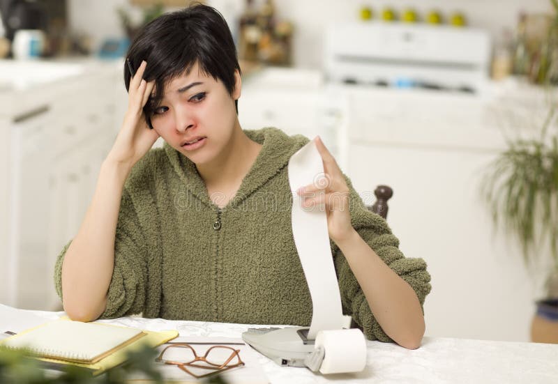 Multi-ethnic Young Woman Agonizing Over Financials Stock Image - Image ...
