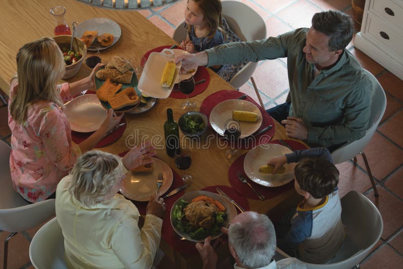 Multi-generation Family Having Food on Dining Table Stock Image - Image ...