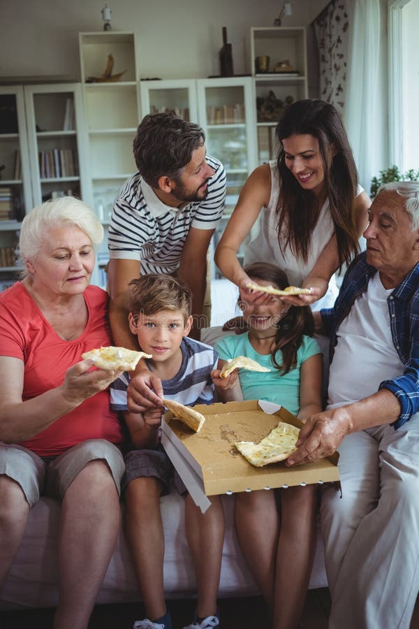 Happy Multi-generation Family Using Digital Tablet in Living Room Stock ...