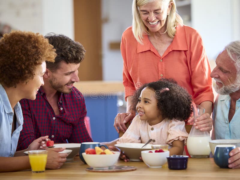 Multi-Generation Family at Home Enjoying Breakfast Together Stock Photo ...