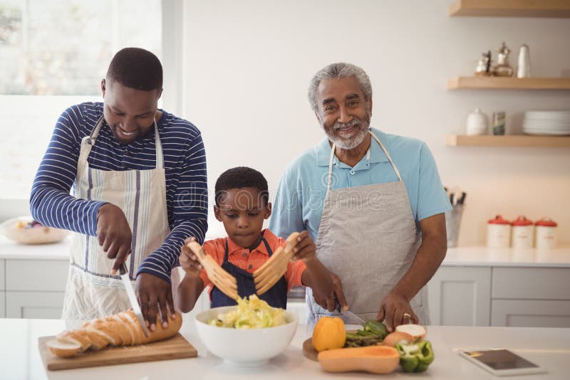 Multi-generation Family Preparing Food in Kitchen Stock Image - Image ...