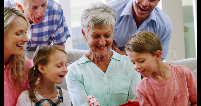 Multi-generation Family Sitting Together in Living Room Stock Footage ...