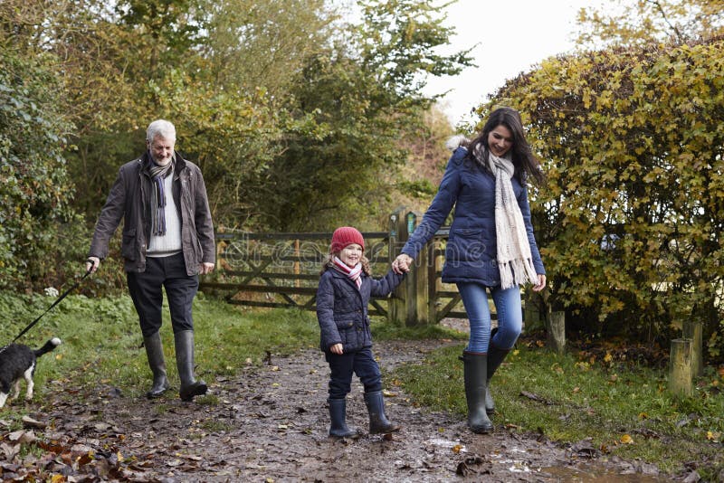 Multi Generation Family Take Dog for Walk in Fall Landscape Stock Image ...