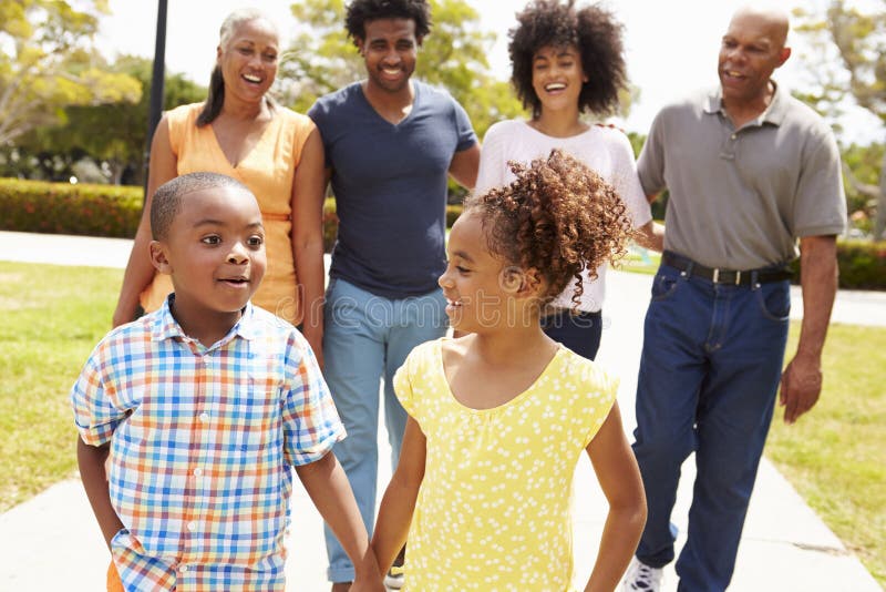 Multi Generation Family Walking in Park Together Stock Image - Image of ...