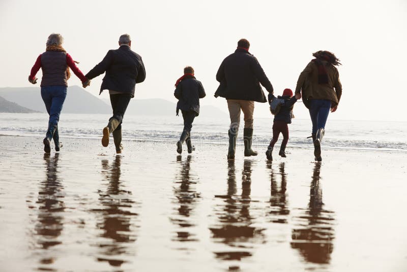 Multi Generation Family Walking on Winter Beach Stock Photo - Image of ...