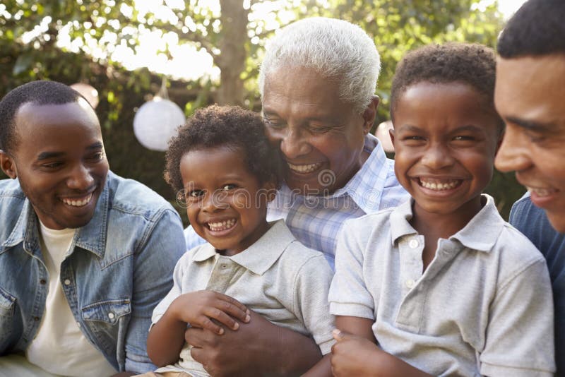 Multi Generation Black Family Look at Each Other in Garden Stock Image ...