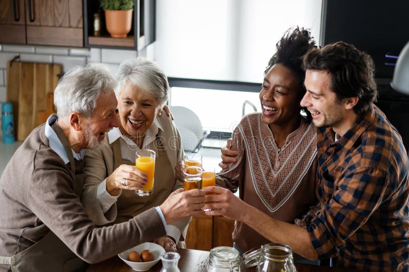 Multi Generation Multiethnic Family Having Fun, Talking Around a ...